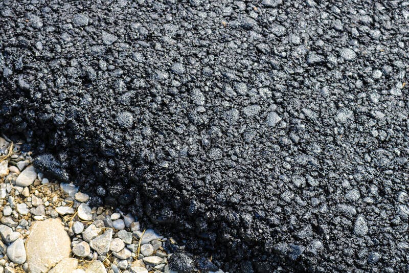 New Layer of Asphalt Road Under Construction with Support from the ...