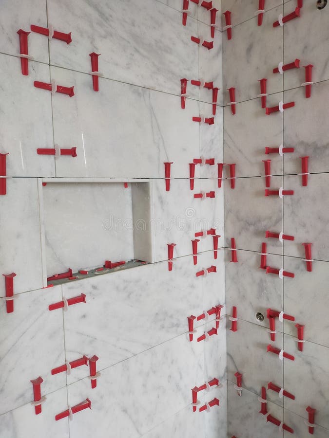 New Marble Tiles Installation with Spacers before Grout is Applied ...