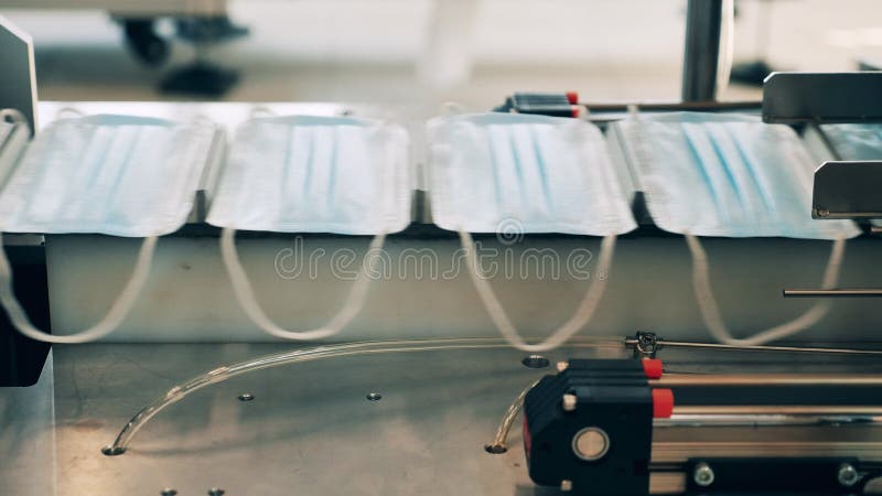 New Medical Masks are Moving Along the Conveyor Machine Stock Footage ...