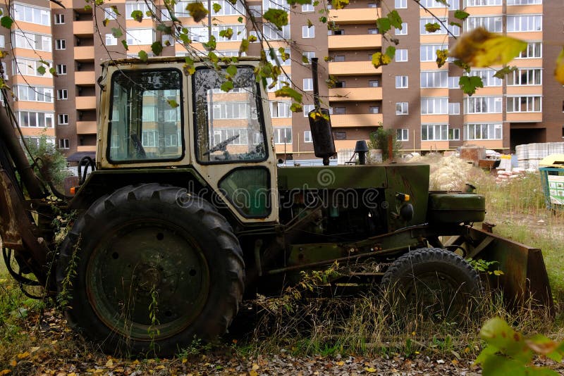 New Modern Building in Process with Vintage Tractor Green Color Stock ...