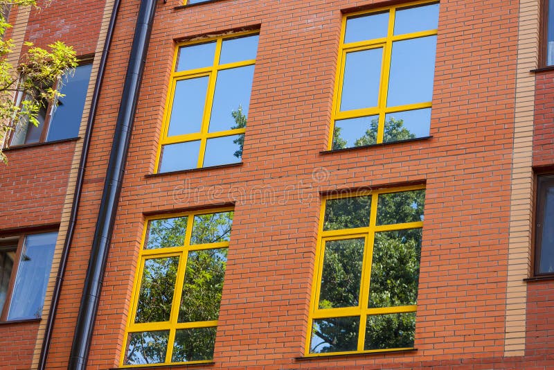 New Modern Building with Yellow Windows Stock Image - Image of housing ...