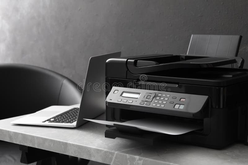 New Modern Printer and Laptop on Grey Table Indoors Stock Photo - Image ...