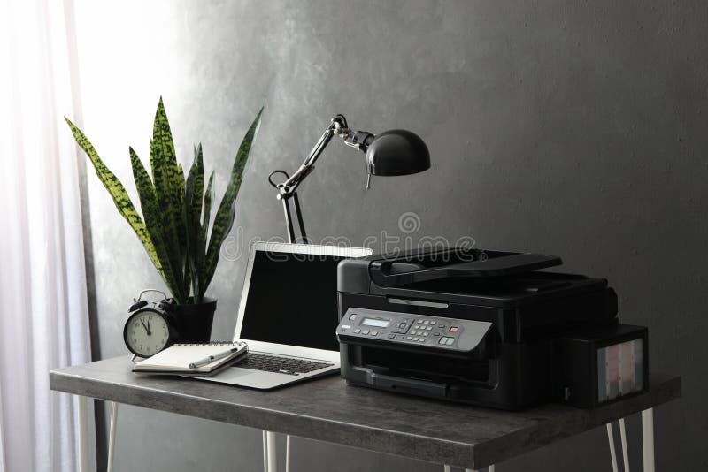 New Modern Printer and Laptop on Grey Table in Office Stock Image ...