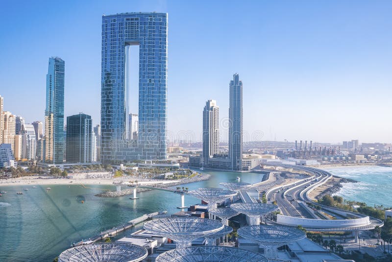 Beautiful Modern Skyscrapers with Beach Against Clear Blue Sky Stock ... Beautiful Modern Skyscrapers with Beach Against Clear Blue Sky Stock ...