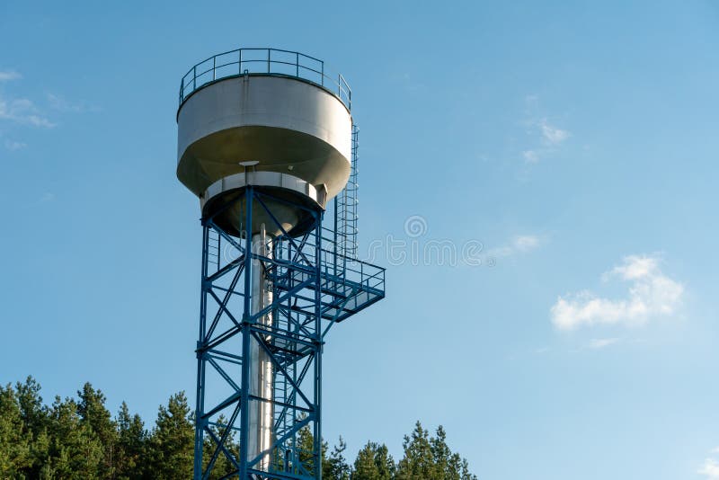 New Modern Water Tower on the Background of Blue Sky and Forest ...