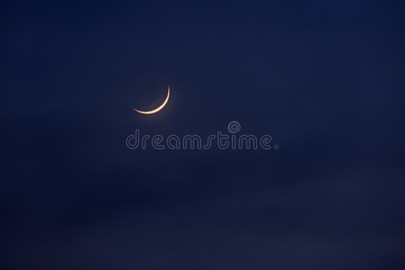 New Moon in the Initial Phase on a Dark Night Sky Stock Photo - Image ...