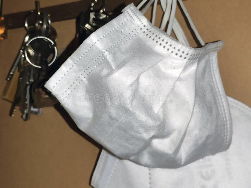 New Normal - Medical Face Masks Hanging on the Wall with Keys Stock ...