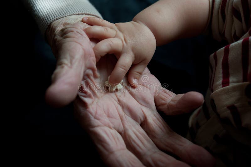 Young and old hands stock photo. Image of play, present - 35198542