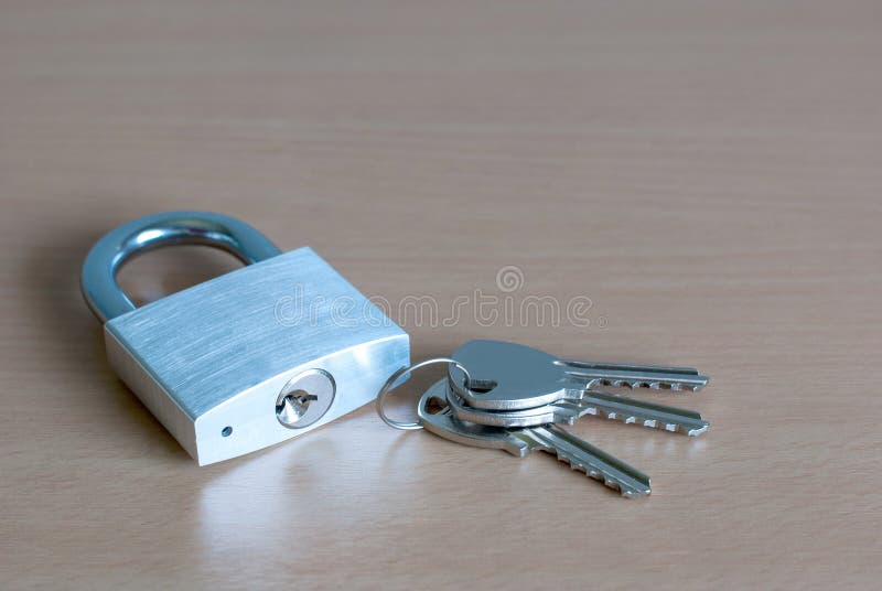 New Padlock with Keys Isolated on a Wooden Table. Stock Image - Image ...