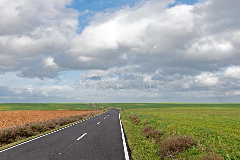 New Paved Two-way Road Empty Dashed Line between Green Fields and ...