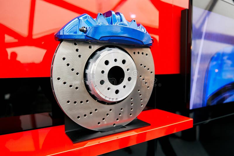New Perforated Brake Disc and Blue Brake Caliper Stock Image - Image of ...