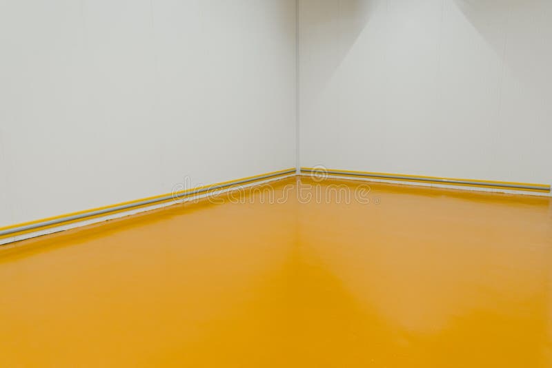 New Polished Concrete Floor Covered with a Layer of Yellow Epoxy Resin ...