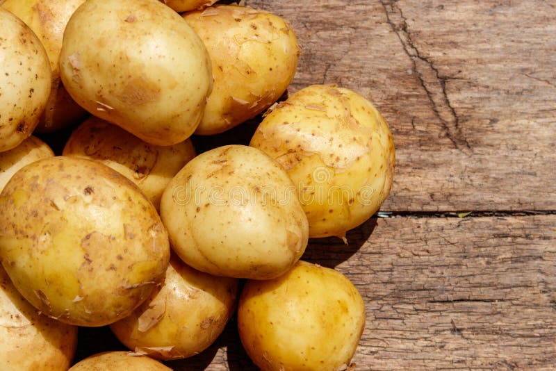 New Potatoes on Rustic Wooden Table Stock Photo - Image of organic ...