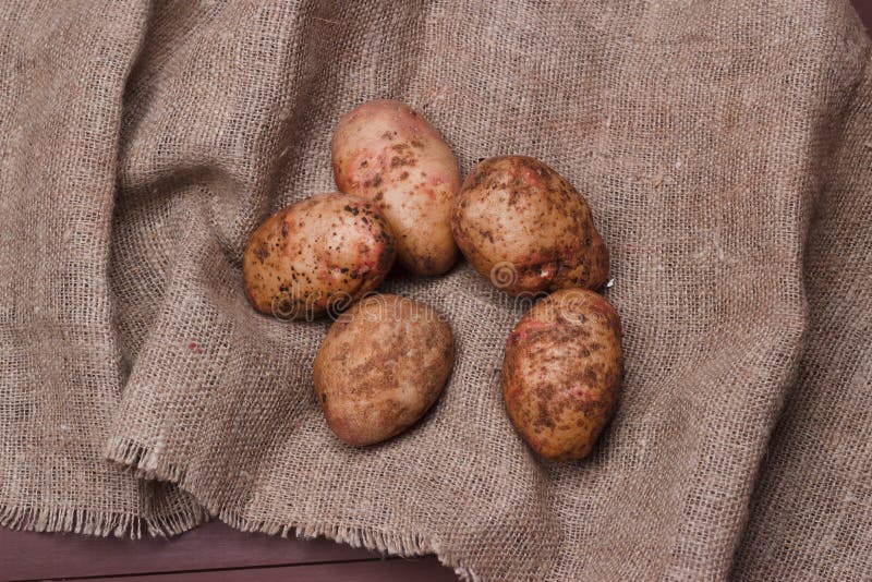 New Potatoes on Sackcloth on Wooden Table, Top View Stock Photo - Image ...