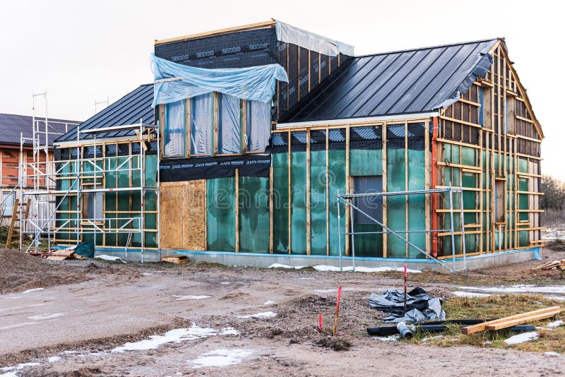 A New Private House is Being Built. Scaffolding is Installed Near the ...