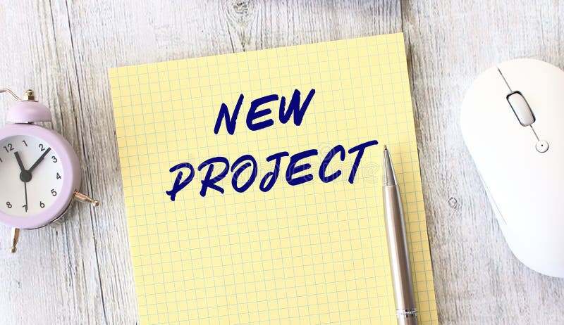 NEW PROJECT Text Written in a Notebook Lying on a Wooden Work Table ...