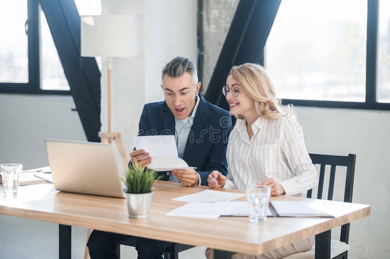 Two Business Partners Discussing New Offer and Looking Involved Stock ...