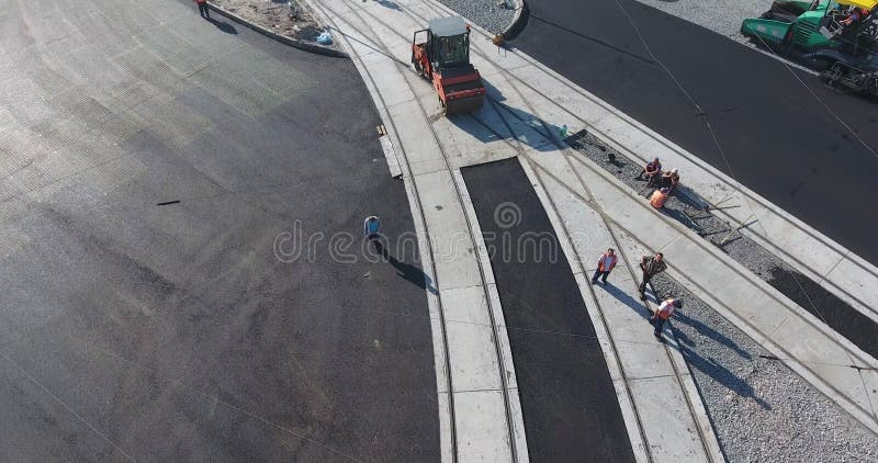 Asphalt Spreading Machine and Vibration Roller at Pavement Road Works ...