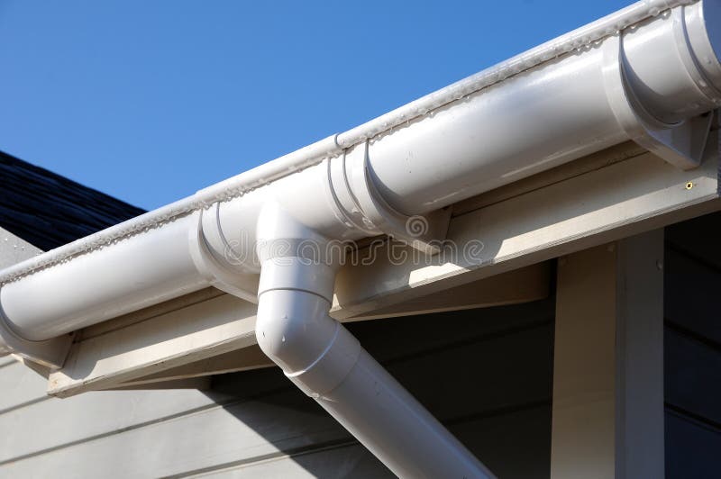 New Rain Gutter on a Home Against Blue Sky. Stock Photo - Image of roof ...