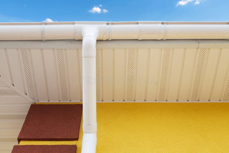 New Rain Gutter on Yellow Wall. Stock Photo - Image of exterior, pipe ...