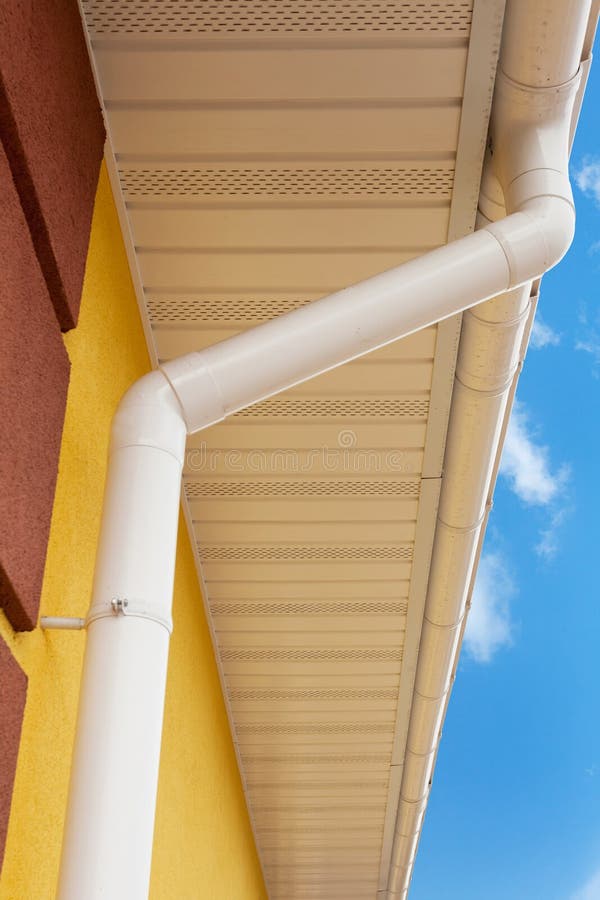 New Rain Gutter on Yellow Wall. Stock Image - Image of gutter ...