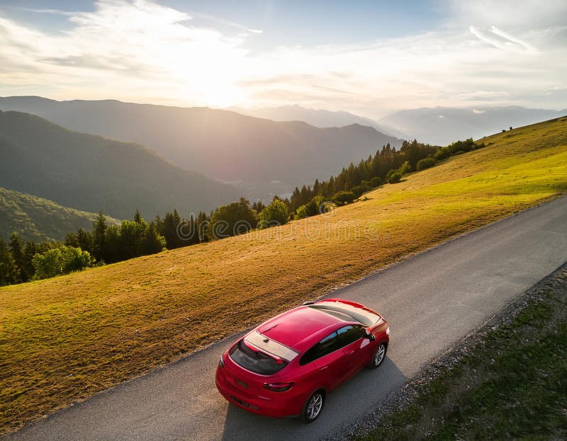 A New Red Car Pulled Over on the Side of a Remote Mountain Road Stock ...
