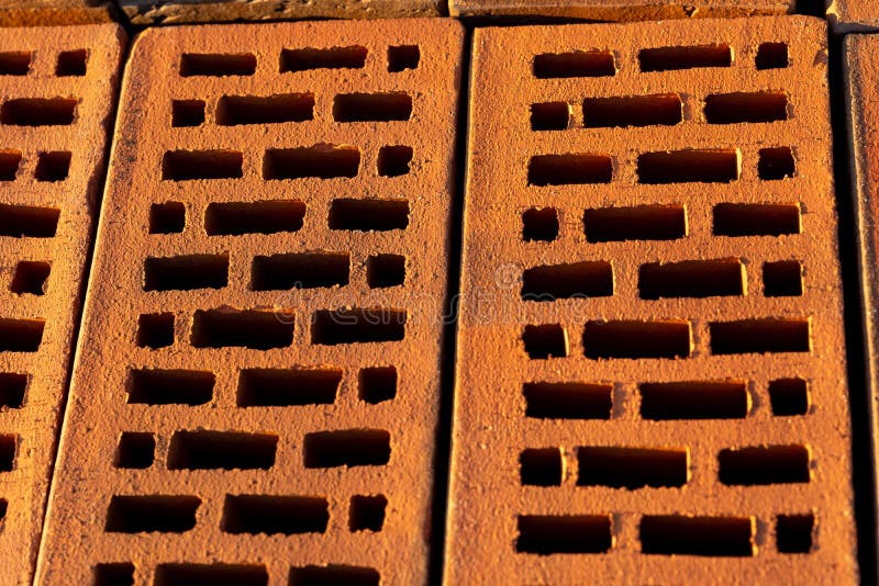 New Red Hollow Bricks at a Construction Site at Sunset. Rows of Trim ...