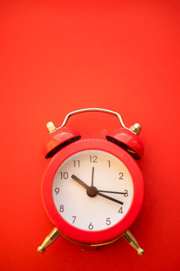 New Red Round Clock on Red Table, Side View Stock Photo - Image of ...