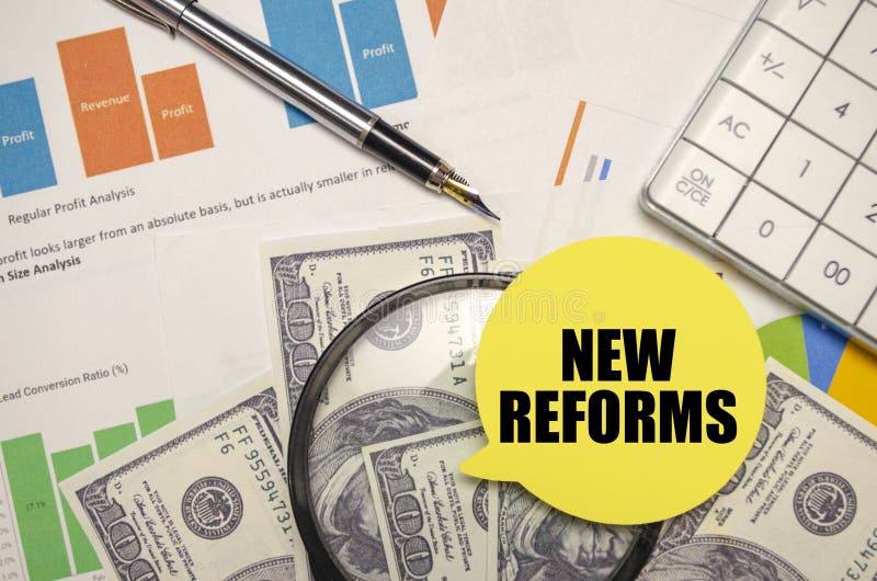 NEW REFORMS on Yellow Sticker with Pen and Calculator Stock Photo ...