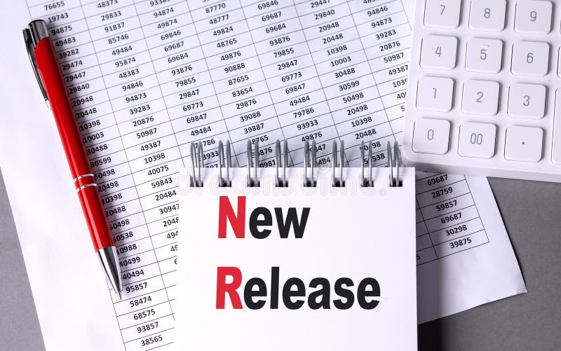 NEW RELEASE Text on Notebook with Pen, Calculator and Chart on Grey ...