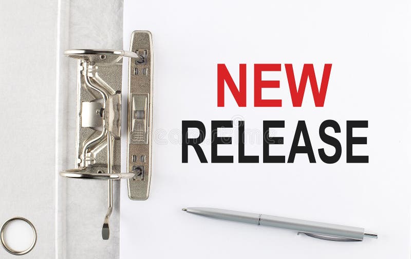NEW RELEASE Text on the Paper Folder with Pen. Business Concept Stock ...