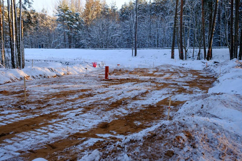 New Road Construction Site in the Forest in Winter with Snow and Mud ...