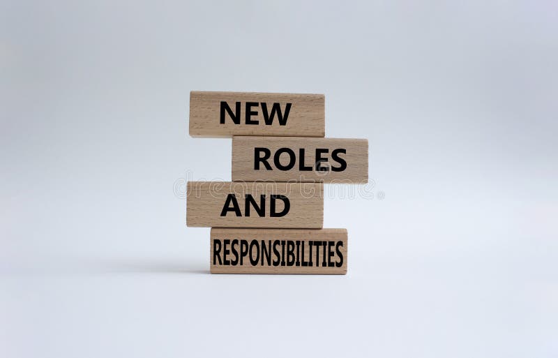 New Roles and Responsibilities Symbol. Wooden Blocks with Words New ... New Roles and Responsibilities Symbol. Wooden Blocks with Words New ...