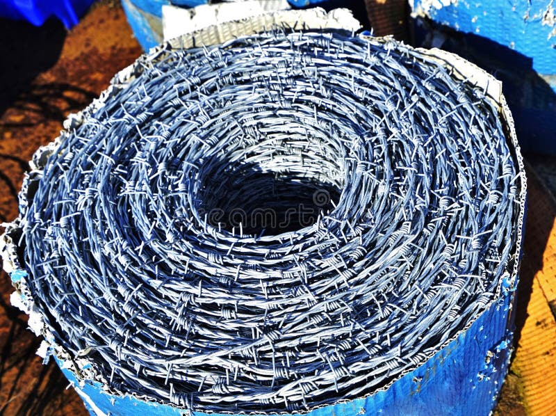 New rolls of barbed wire stock image. Image of enclosure - 332877563