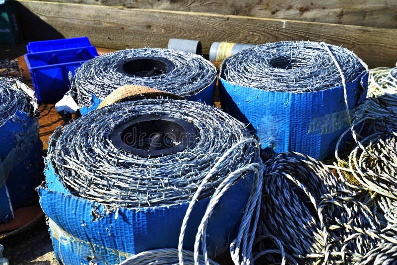 New rolls of barbed wire stock image. Image of construction - 332877587