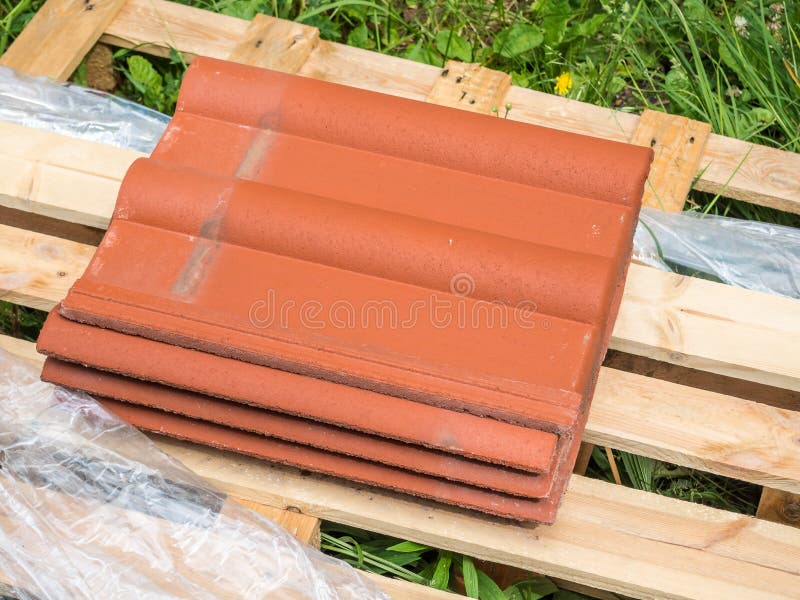 New Roof Tiles on a Building Site Stock Photo - Image of home, tiles ...