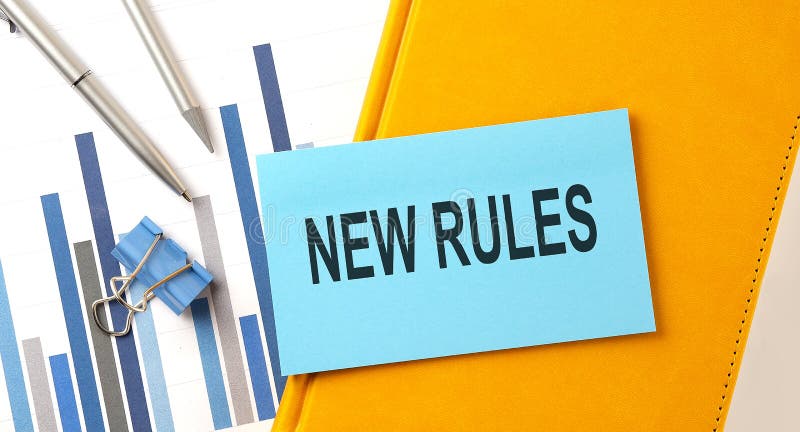 NEW RULES Text on Sticker on the Yellow Notebook with Chart and Pen ...