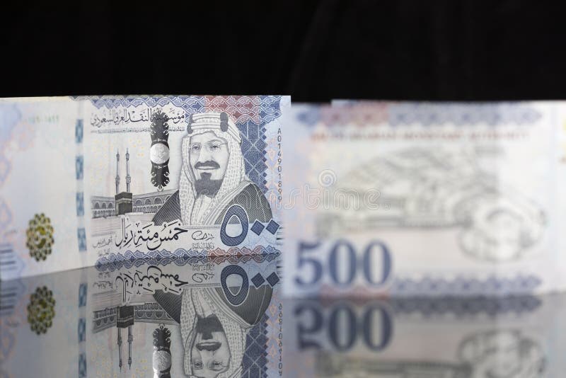 New Saudi Riyal Notes on a Dark Reflective Surface Stock Image - Image ...