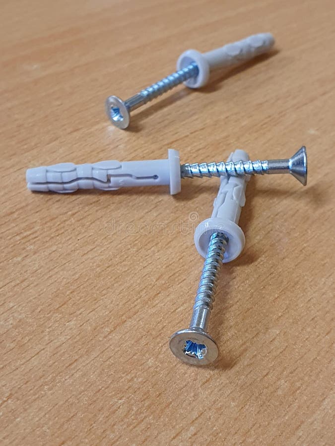 New screws on the table stock photo. Image of construction - 204177282