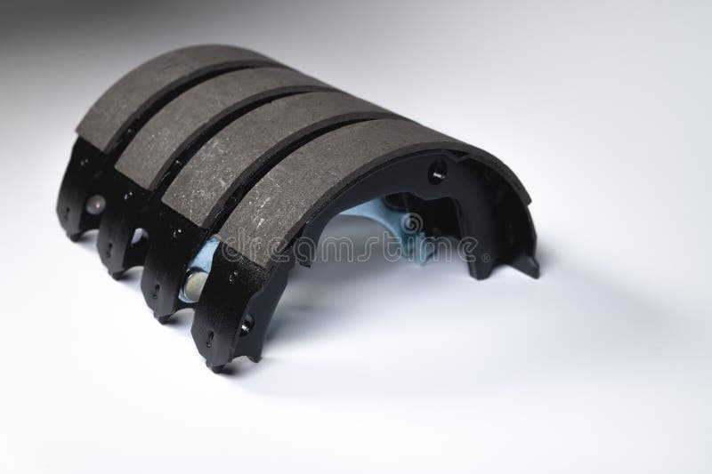 New Set of Four Brake Pads for Drum Brakes on a Gray Background Stock ...