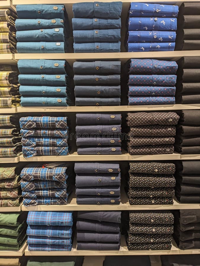 New Shirts on Shelf of a Store Editorial Photo - Image of textile, wood ...