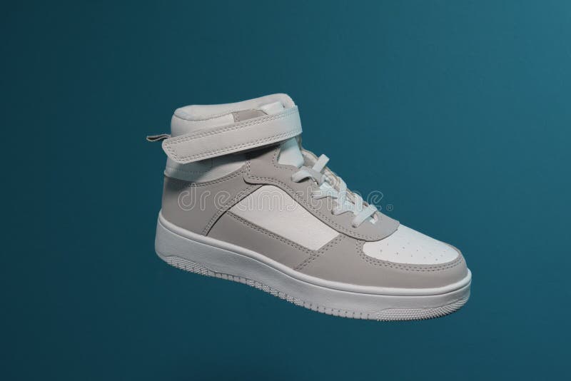 New Simple White Sneaker on a Blue Background. Shape and Volume Stock ...