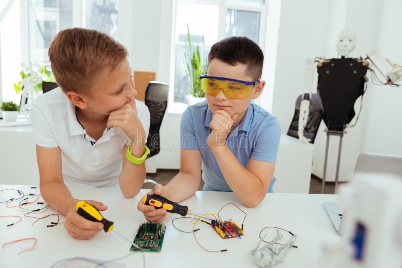 Smart nice boys thinking stock photo. Image of machinery - 120830104
