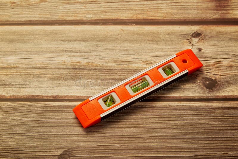 New Spirit Level on Wood Background Stock Image - Image of water ...