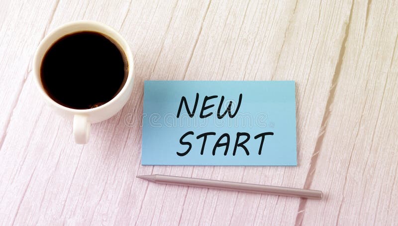 NEW START Text on the Blue Sticker with Cofee and Pen Stock Image ...