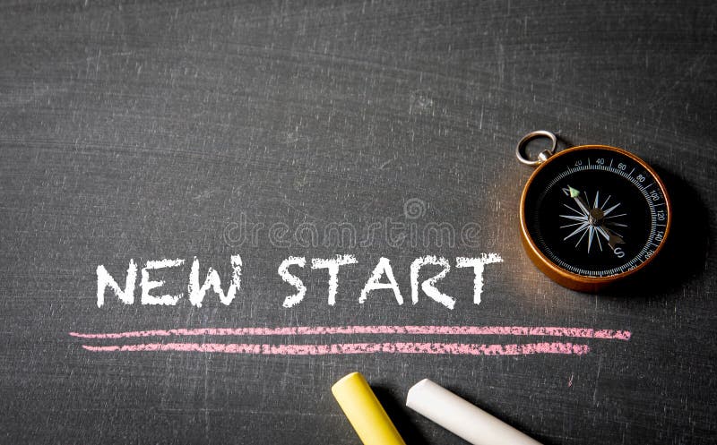 New Start. Text, Compass and Pieces of Chalk on Blackboard Background ...