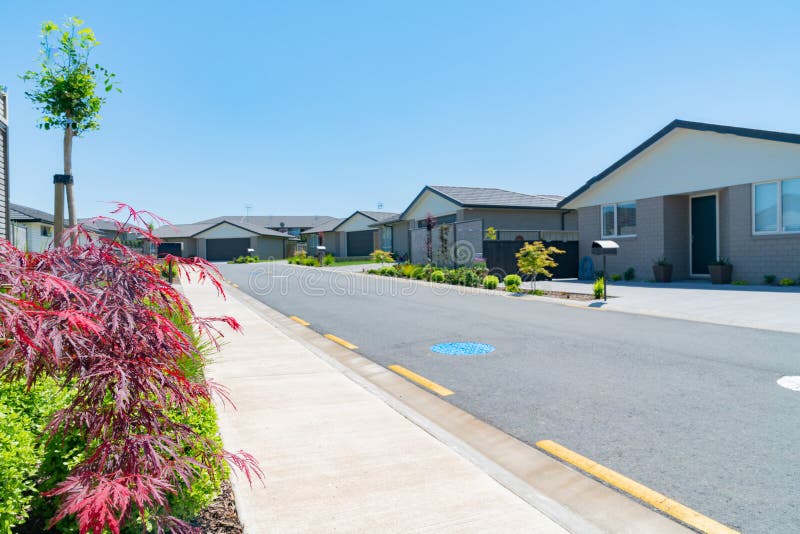 New Subdivision Street with Uniform Homes Stock Image - Image of people ...