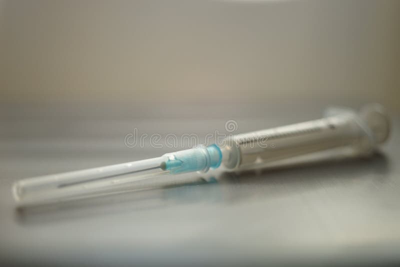 New Syringe on Chrome the Table, Side View Stock Photo - Image of ...