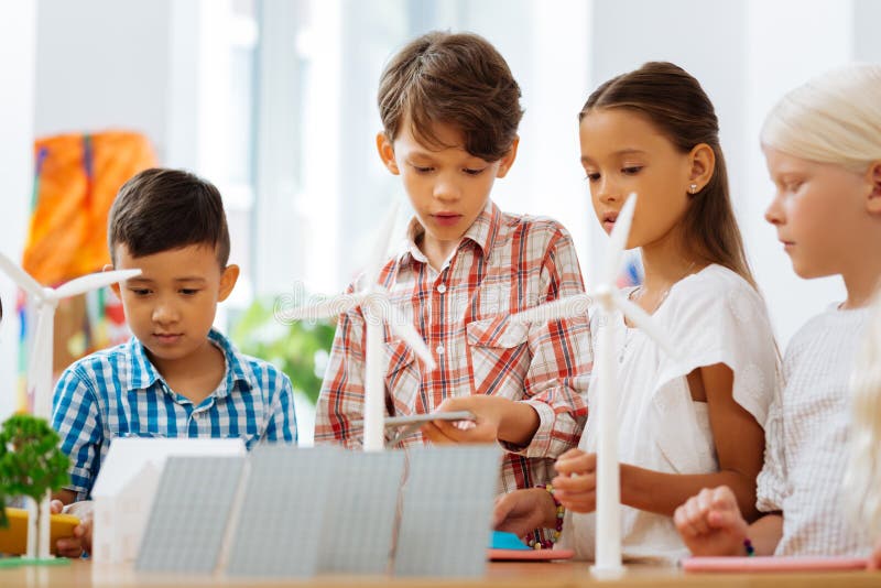 Attentive Kids Thinking about the Task in a Classroom Stock Image ...
