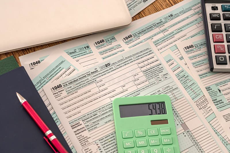 New Tax Forms 1040 Two Calculators Pen Notebook and Notebook Lie on a ...